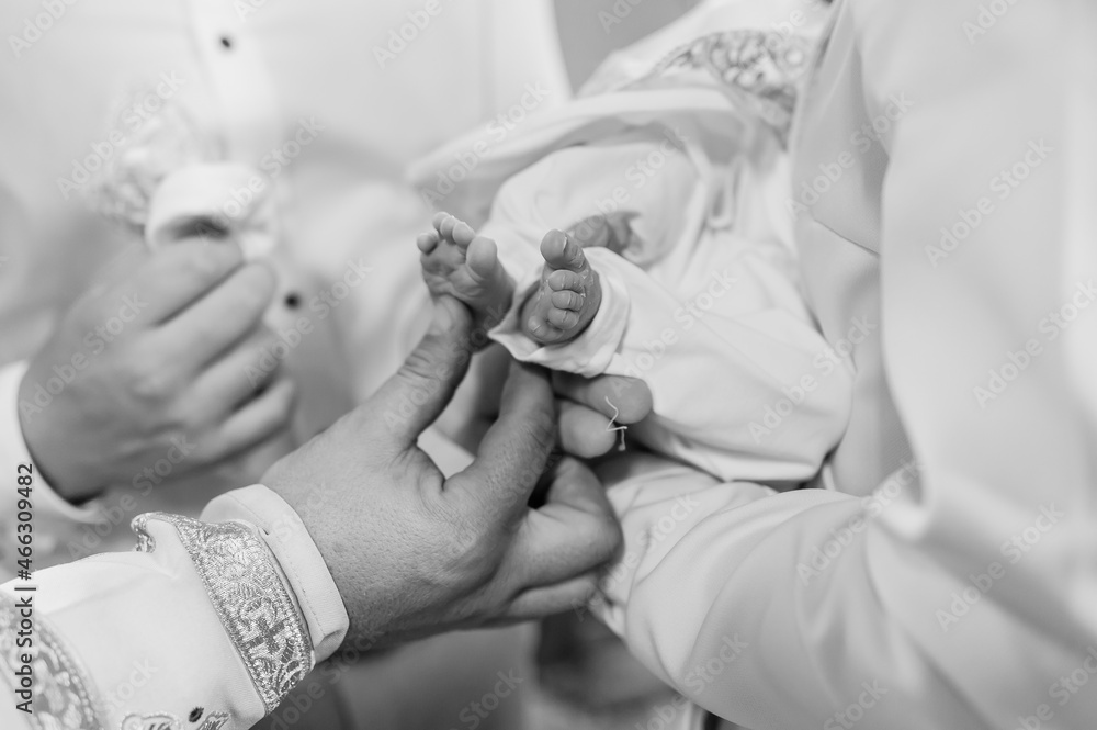 sacrament of baptism the priest baptizes the child with the anointing ...