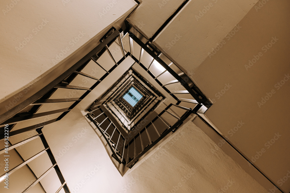 Abstract interior fragment of square shaped flight of stairs in modern ...