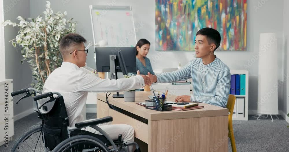Two men meet in company office morning for interview disabled boy ...