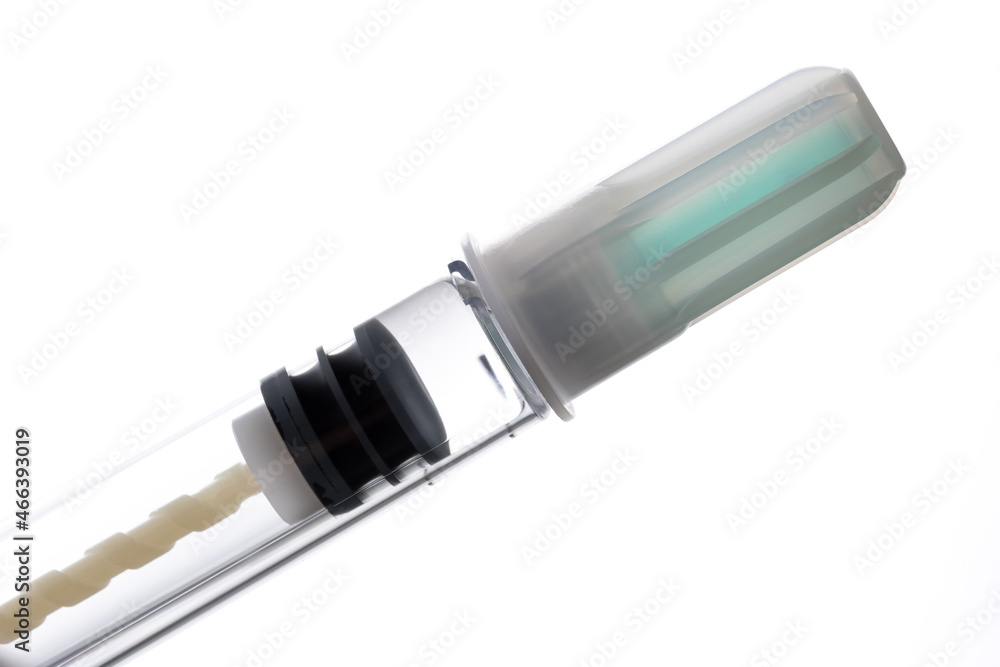 insulin pen needle with safety cap, threaded to attach securely and ...