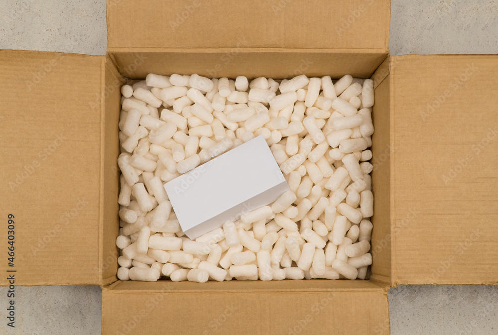 Cardboard box with styrofoam filler for safe packaging. Gift package ...