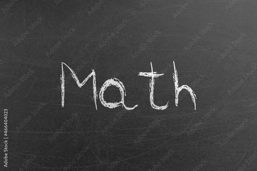Math word written by chalk on a school blackboard before an exam ...