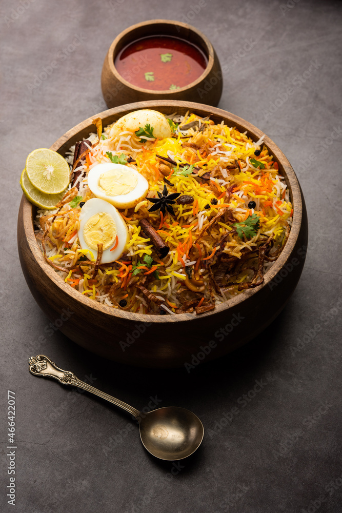 Anda biryani or egg biryani served in handi or plate Stock Photo ...