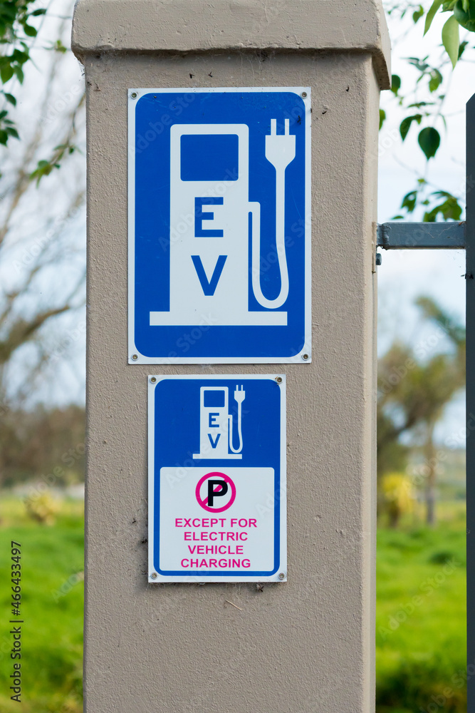 EV electric vehicle parking sign for recharging concept green energy ...