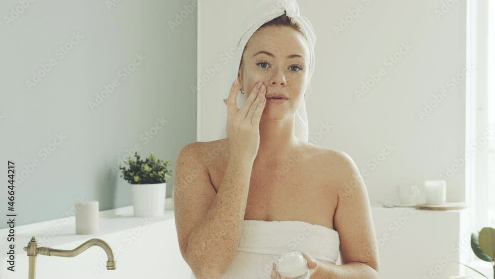 Portrait of young woman in bathroom. female, after waking up and taking ...