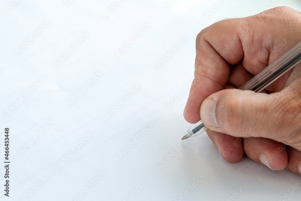 Human hand signing blank white sheet of paper using pen. copy space for ...