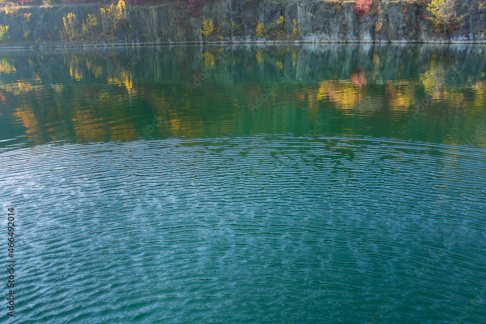 Artificial pond with azure water and picturesque flooded quarries Stock ...