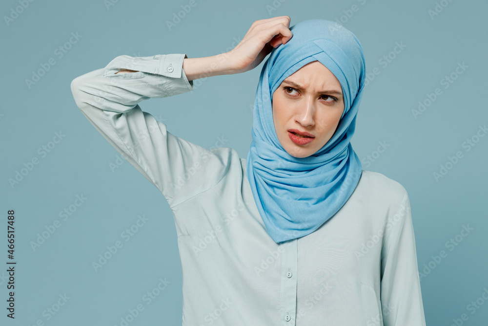 Young puzzled confused arabian asian muslim woman 20s in abaya hijab ...