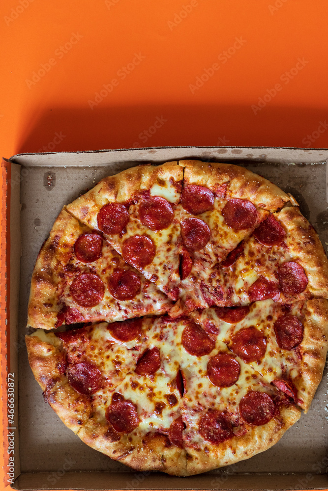 Greasy pizza with ham and cheese, unhealthy food concept Stock Photo ...