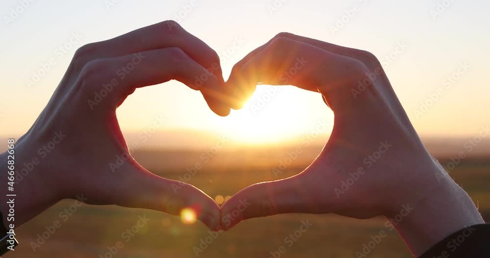 Video Stock Hands of a teenage boy in the form of heart with the ...