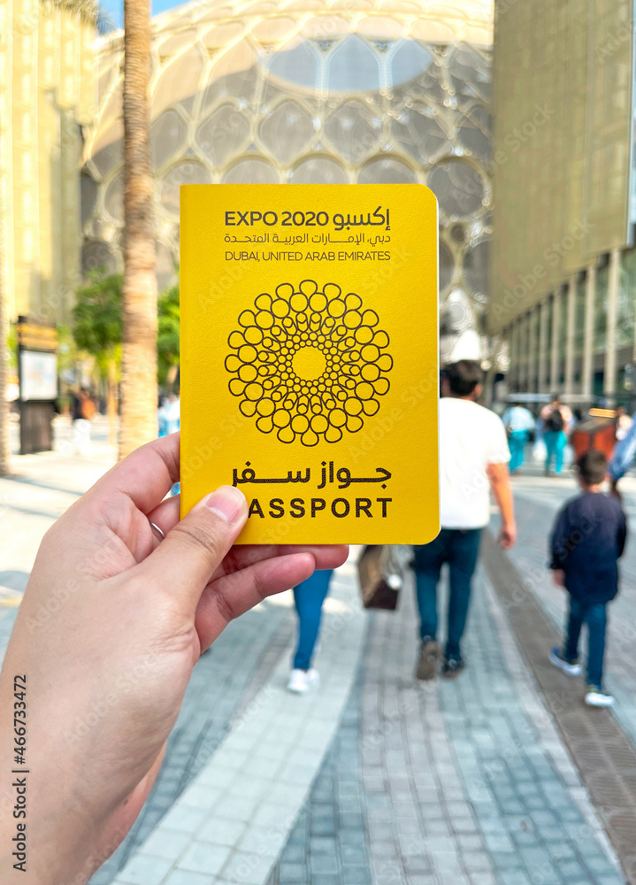 Couple hands holding EXPO 2020 Dubai passports on October 22, 2021 in ...