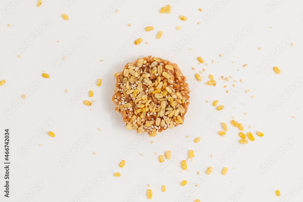 One piece of rice cracker mixed grains topping with Nuts, and White ...