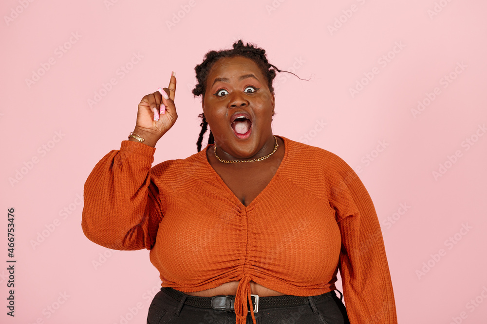 Funny surprised young black overweight body positive woman with ...