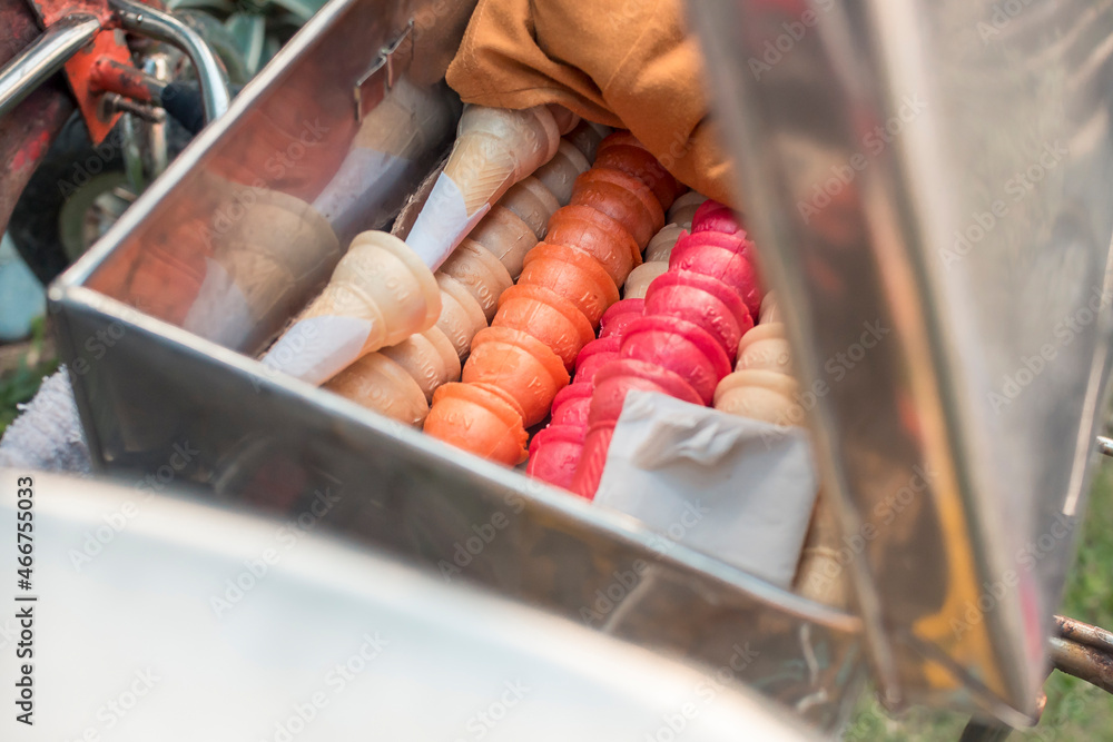 Foto de Small wafer cones inside an ice cream cart. For serving ...