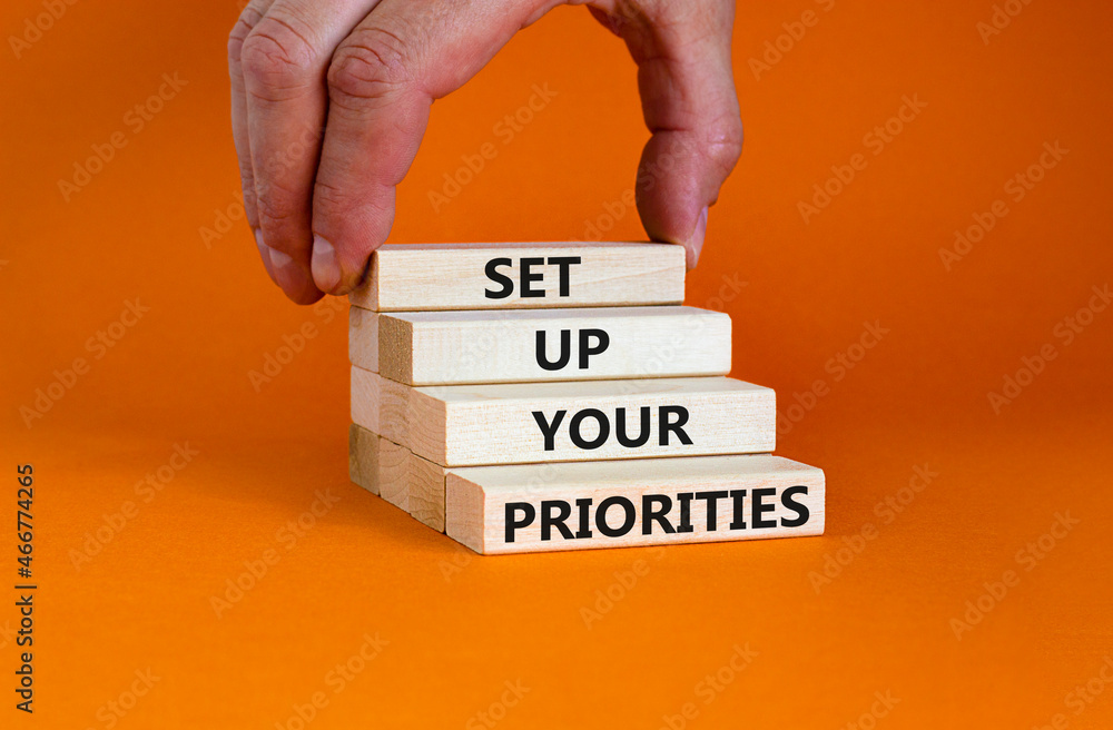 Set up your priorities symbol. Wooden bloks with words 'Set up your ...