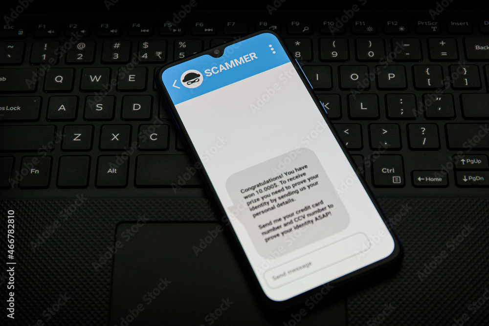 Scammer message on phone. Receiving scam messages online Stock Photo ...