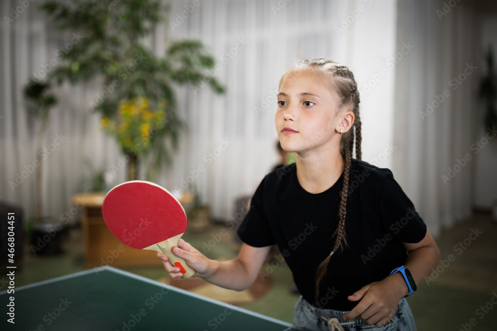 Cute girl playing ping-pong indoors Stock Photo | Adobe Stock
