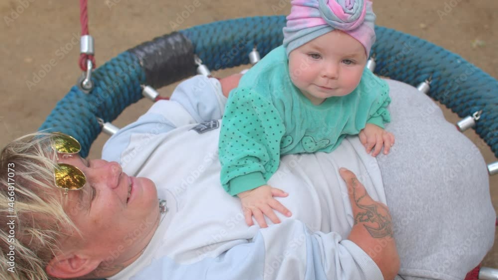 Disabled person with toddler, lifestyle outdoors. Congenital ...