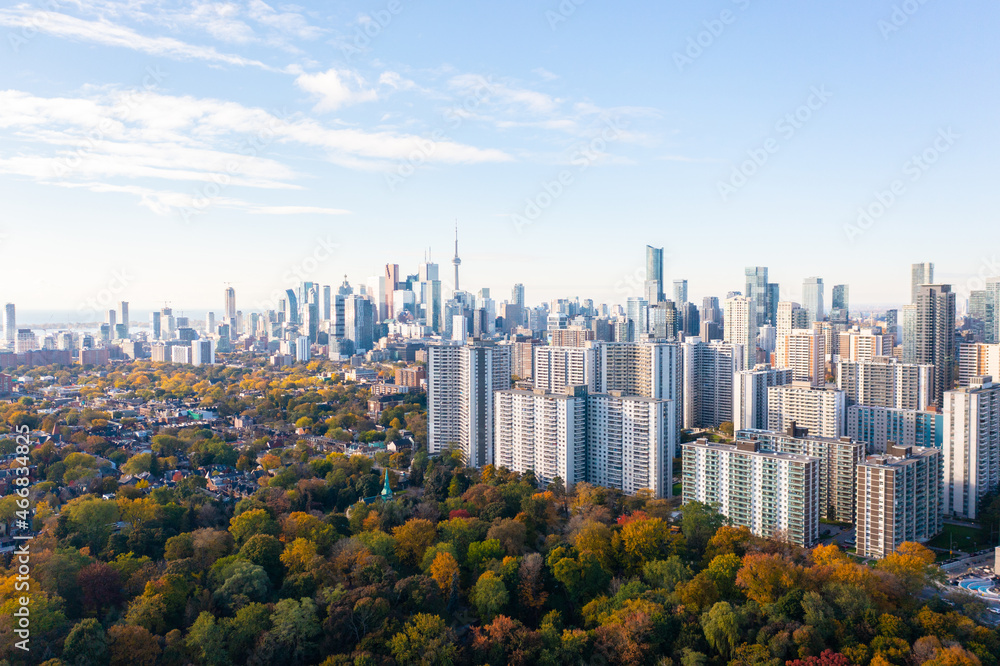 downtown Toronto with Riverdale east park trees with fall colours red ...