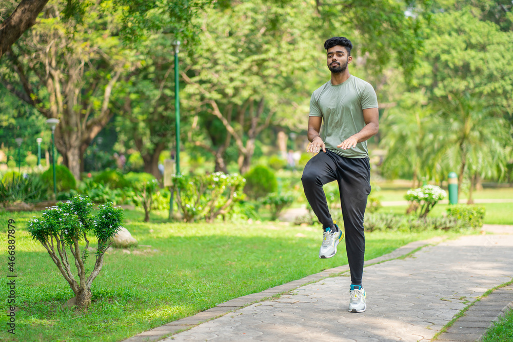 Indian man running on the spot in the park, warming up Stock Photo ...