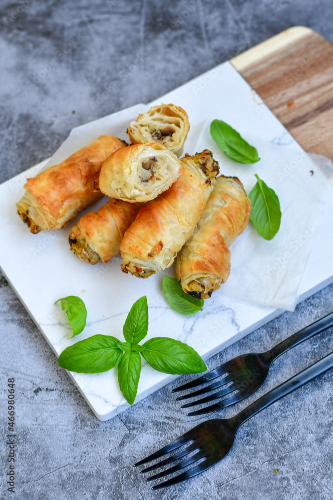 Greek style Mini filo pastry rolls with mushrooms.Home made bakery ...