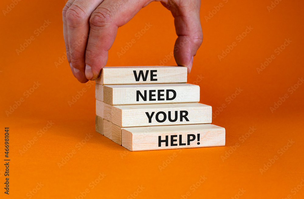 We need your help symbol. Wooden blocks with concept words 'We need ...
