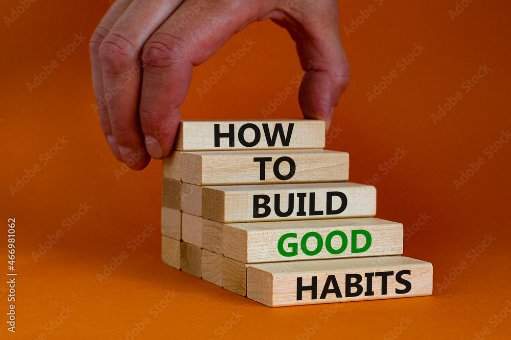 Build good habits symbol. Wooden blocks on beautiful orange background ...