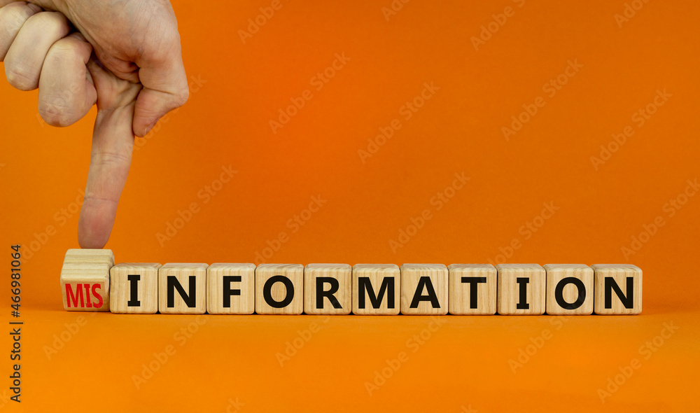 Information or misinformation symbol. Businessman turns cubes and ...