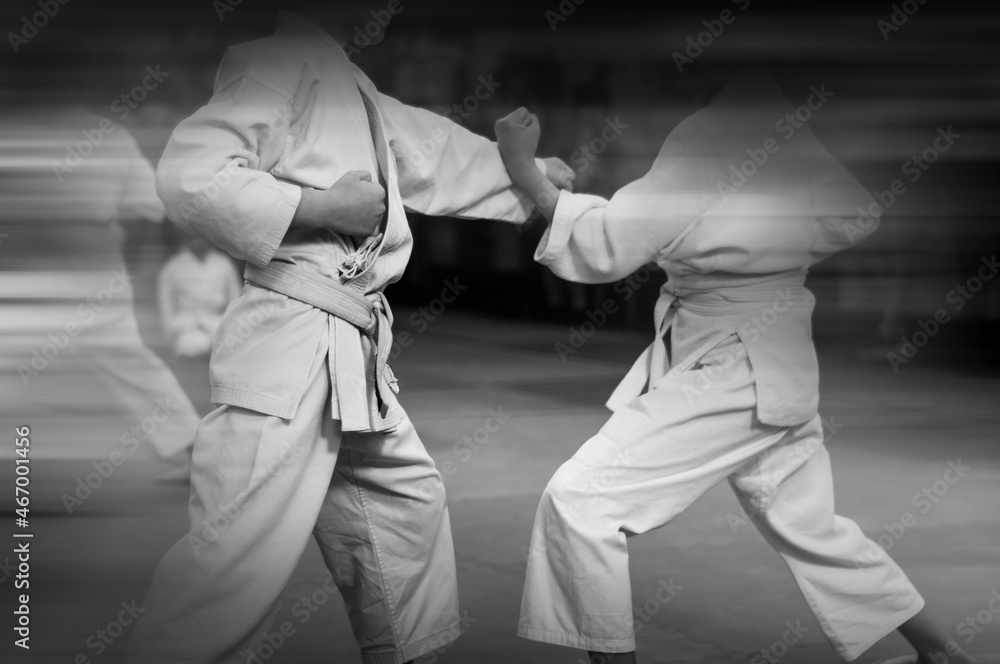 Karate background. Silhouettes of athletes in karate training in retro ...