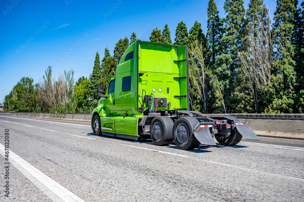 Bright green powerful big rig semi truck tractor without the semi ...