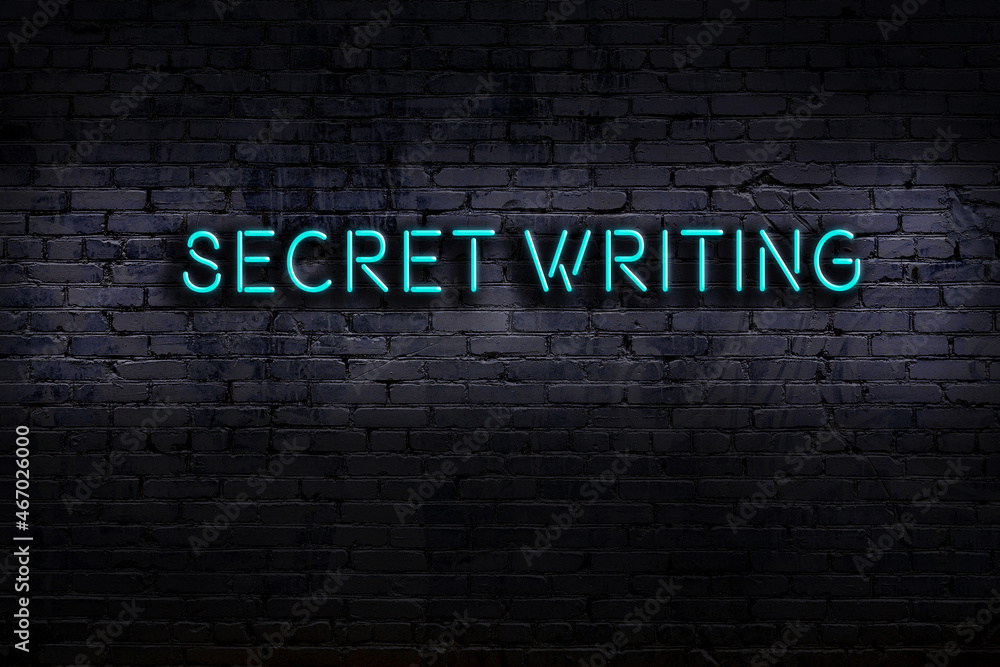 Neon sign. Word secret writing against brick wall. Night view Stock ...