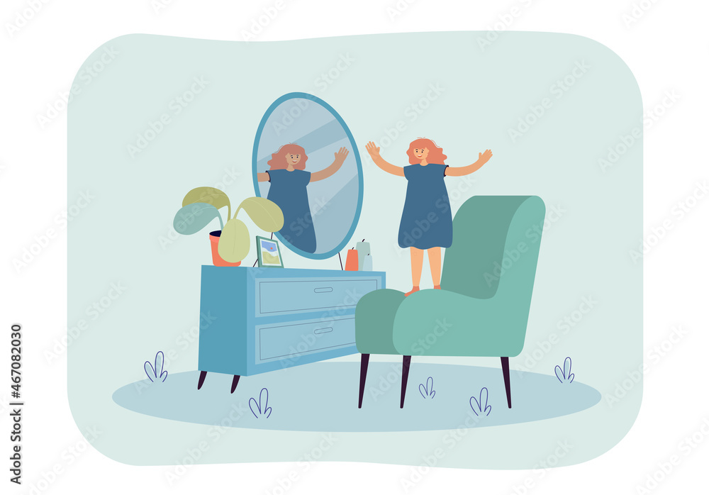 Cute girl standing on chair and looking in mirror. Kid happy to see her ...