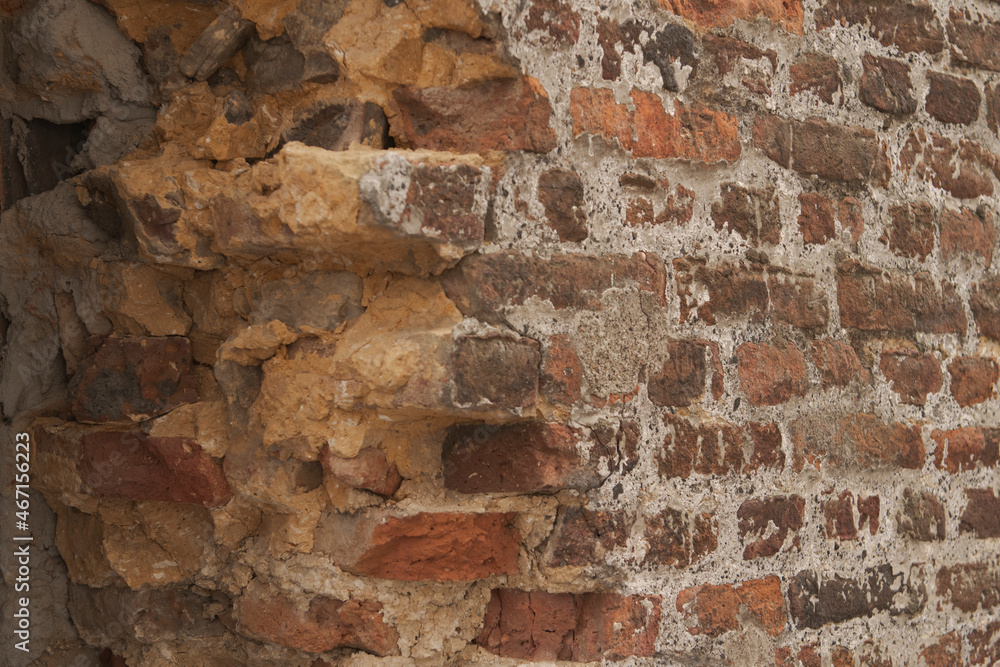 Broken antique brick wall. The structure of a whole and broken brick ...