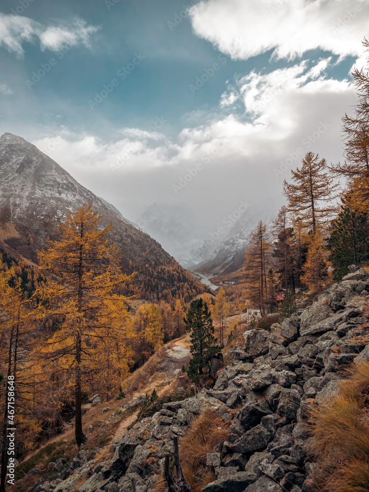 Amazing views over an high alpine valley and snow covered mountains ...