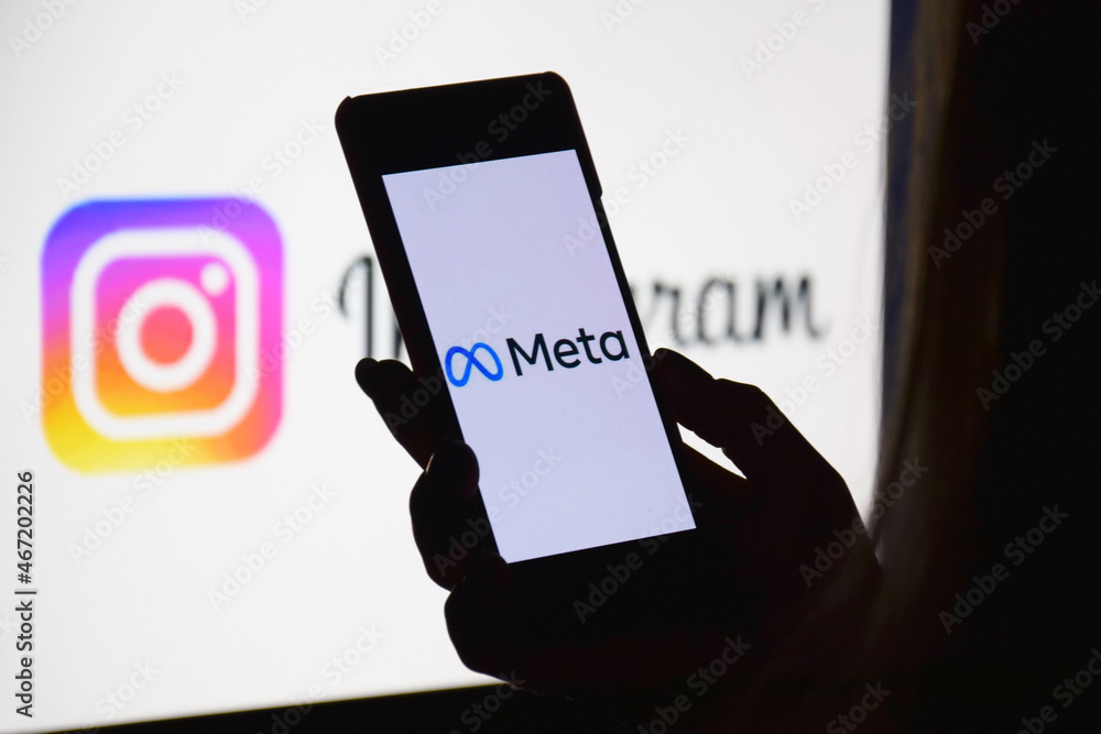 Smartphone with Meta logo on the background on logos of products owned ...