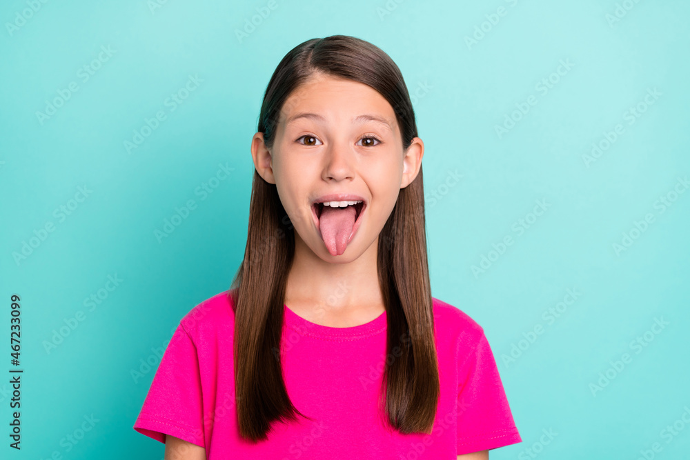 Photo of amazed funky happy little girl bad mood stick out tongue good ...