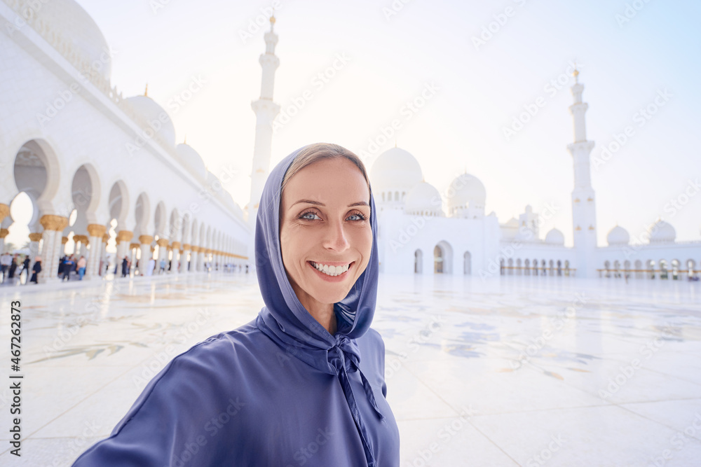 Traveling by Unated Arabic Emirates. Pretty young woman in traditional ...