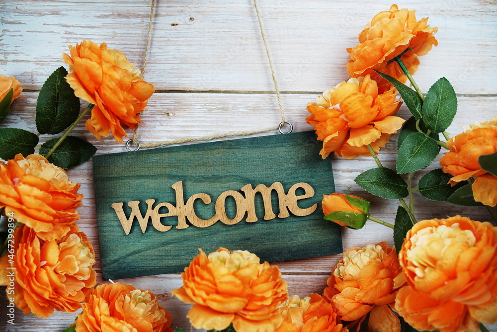 Welcome sign hanging on wooden with flower bouquet decoration Stock ...