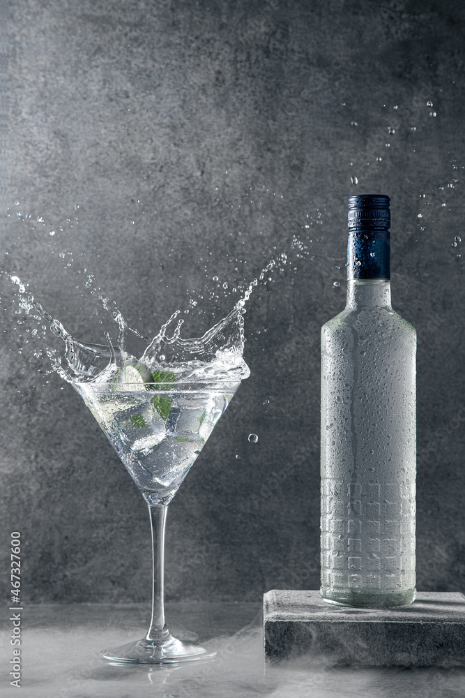 Vodka splash on dark background with copyspace. Vertical format. Stock Photo | Adobe Stock