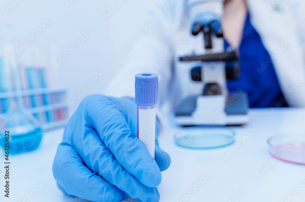 Blood sample vial mockup with copy space. Close up doctor's hand hold ...