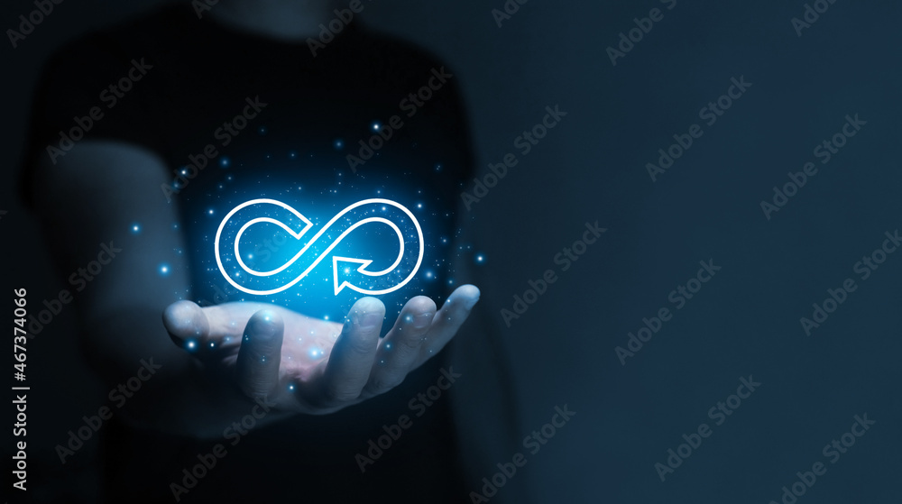 Hand holding Circular economy symbol. Futuristic Circular economy ...