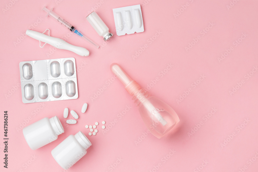 Gynecology concept. Vaginal suppositories, enema, tablets, applicator ...