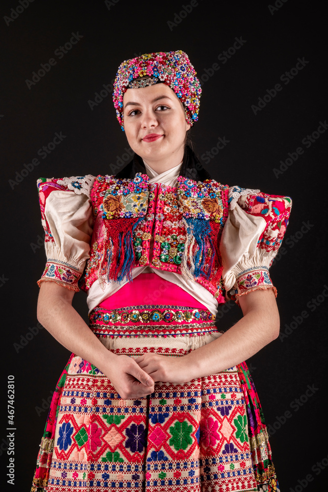 Young beautiful slovak woman in traditional dress. Slovak folklore ...