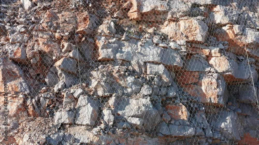 Wire mesh metal net protection against falling rocks. Metal net on a ...
