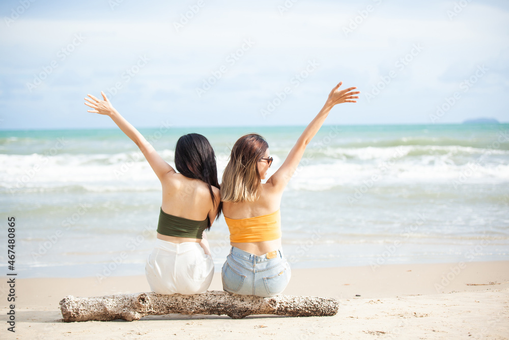 young women asian and friends enjoying on the beach. women asian ...