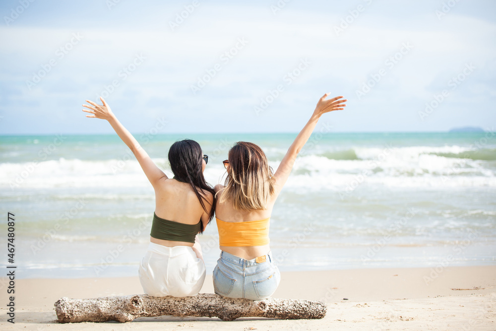 young women asian and friends enjoying on the beach. women asian ...