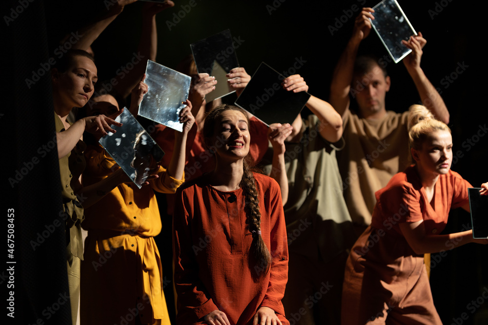 Actors and actresses perform a modern performance on the stage of the ...