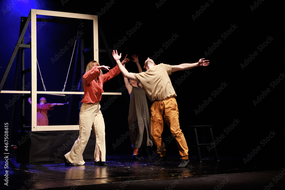 Actors and actresses perform a modern performance on the stage of the ...