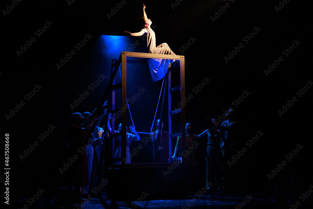 Actors and actresses perform a modern performance on the stage of the ...