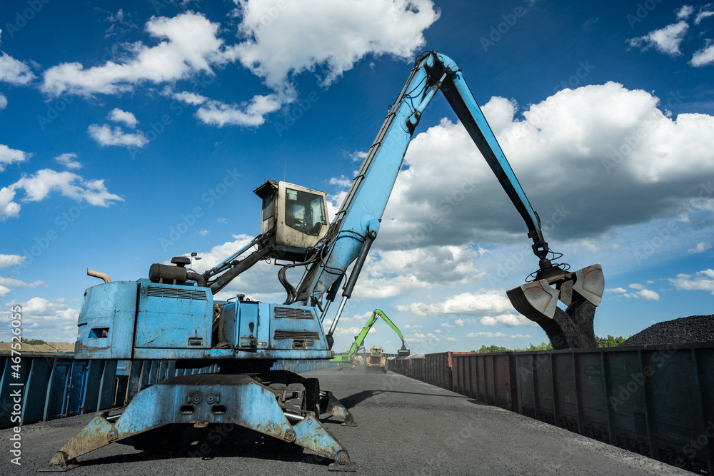 Loading of coal and coke into wagons at the reloading terminal with the ...